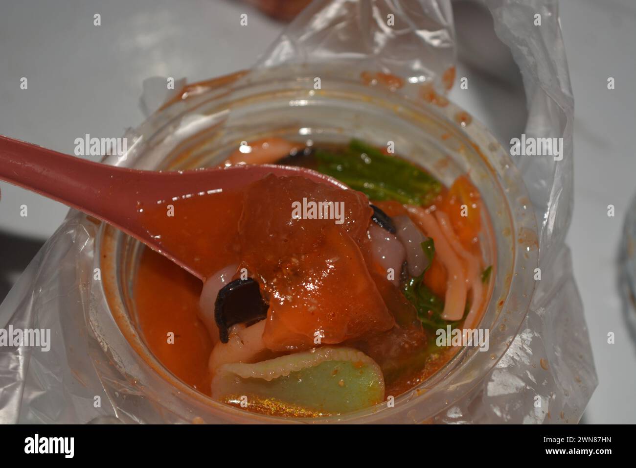 The famous street food in Indonesia is "seblak" with various toppings ...