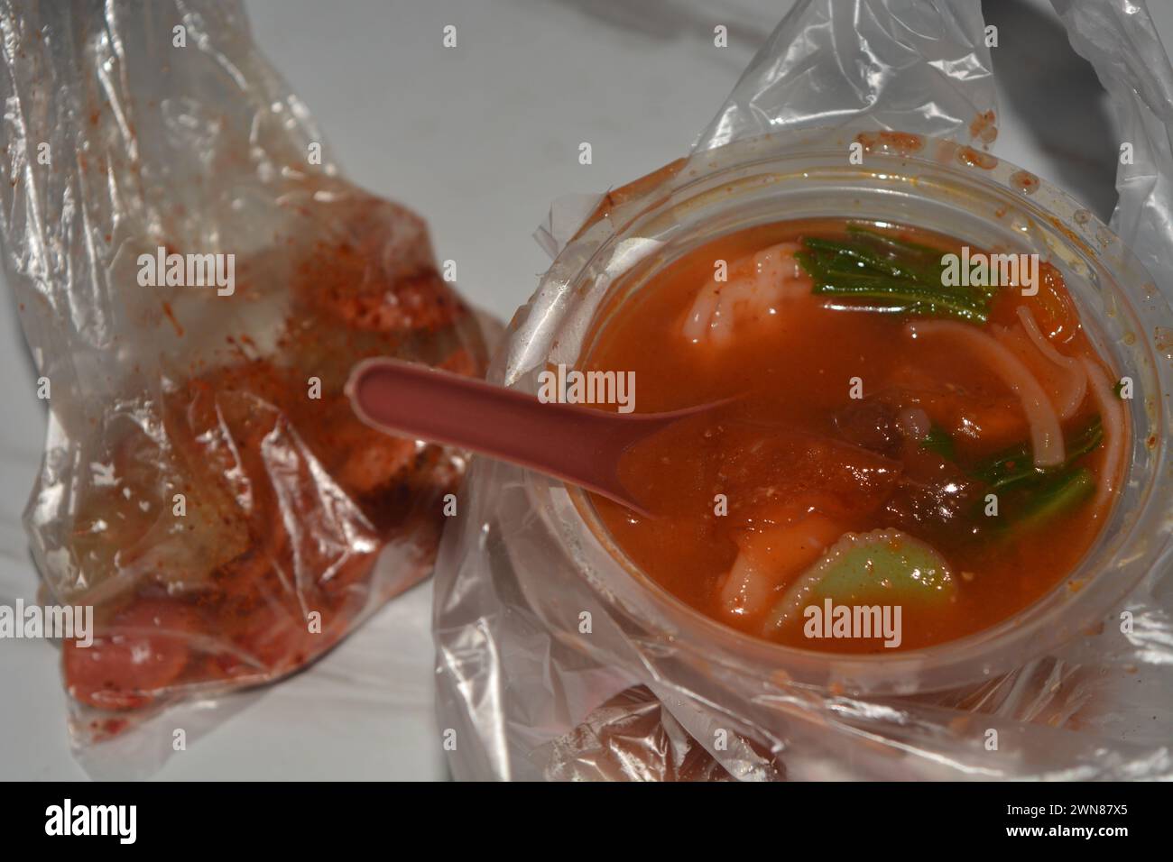 The famous street food in Indonesia is "seblak" with various toppings ...