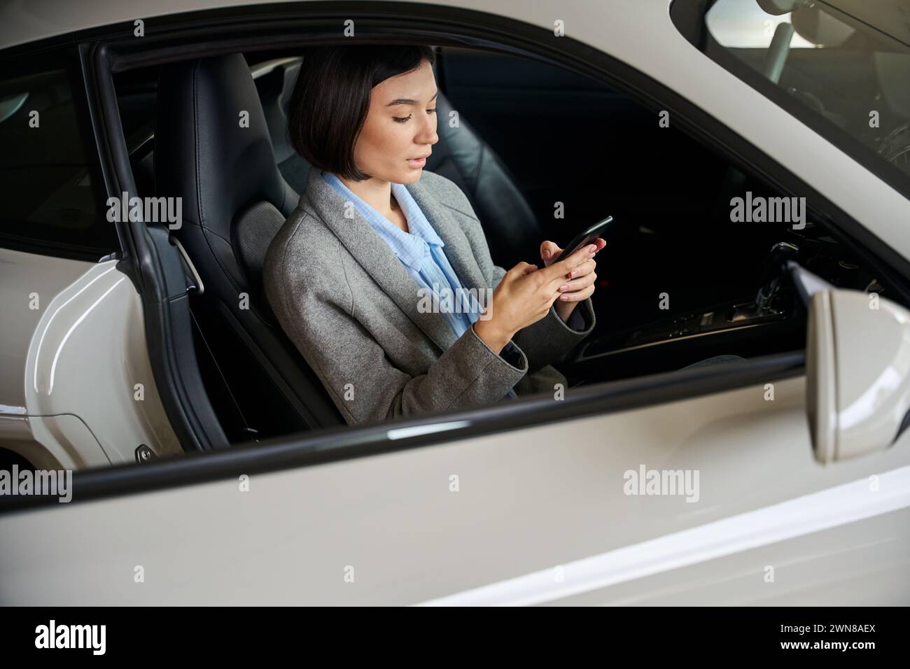 Attractive passenger waiting for driver in car Stock Photo - Alamy