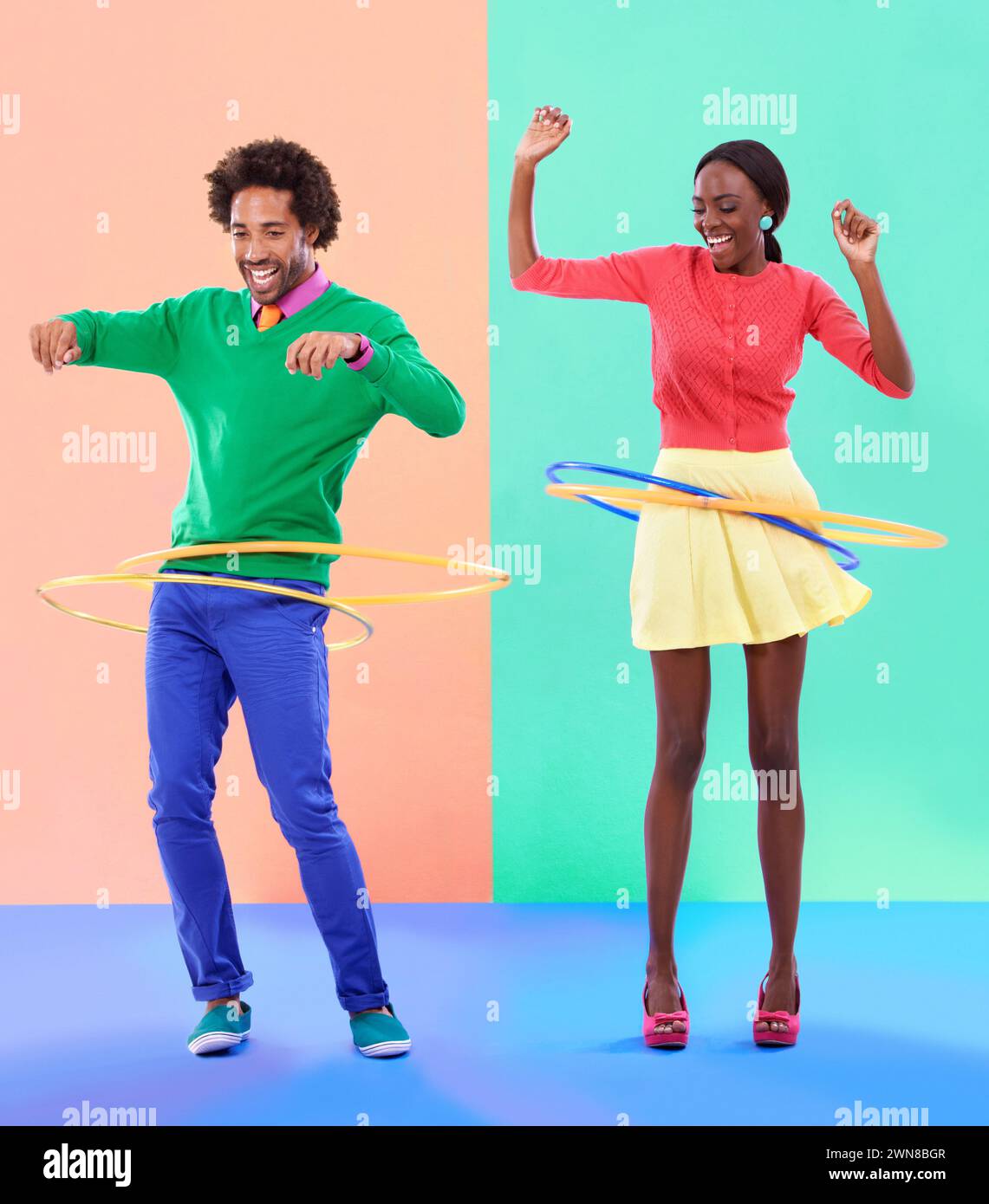 Couple of friends, laugh and play for dance, hoop and competition on ...