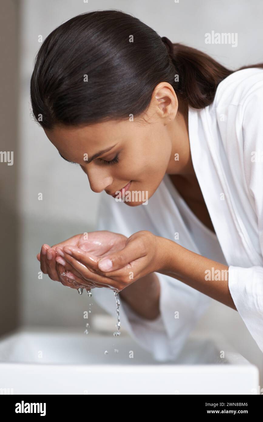 Hands, water and woman washing face for beauty and skincare, wellness ...