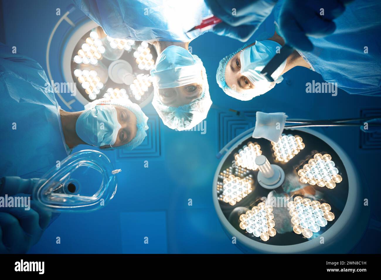 Group of surgeons doing surgery in hospital in the modern operating ...