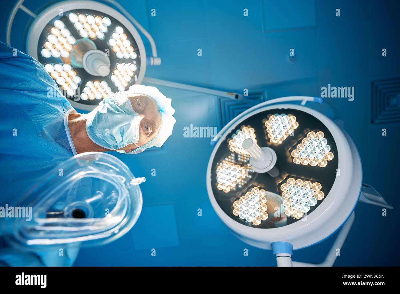 Doctor anesthetist standing above of patient before surgery with with ...