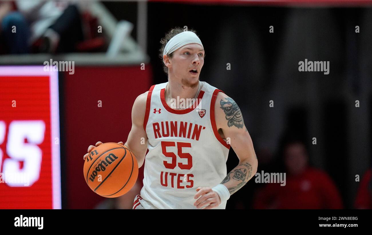 Utah guard Gabe Madsen (55) brings the ball up court during the second ...