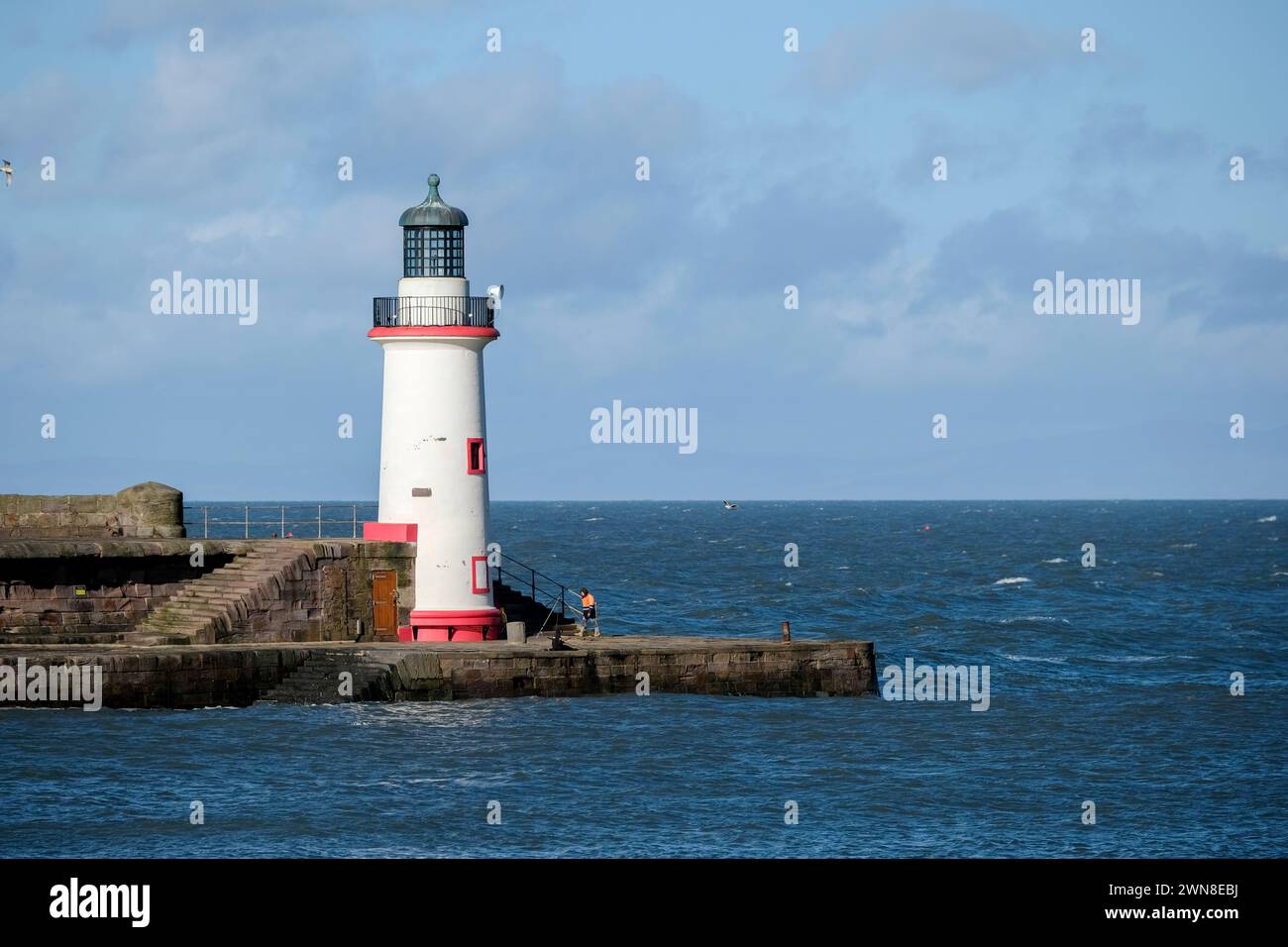 Lighthouse in the Harbour and waterfront in the town of Whitehaven ...