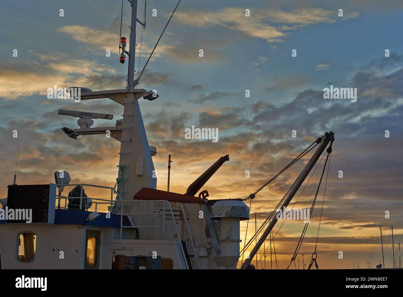 Ship, sunset and harbor at sea to travel with closeup, clouds and ...