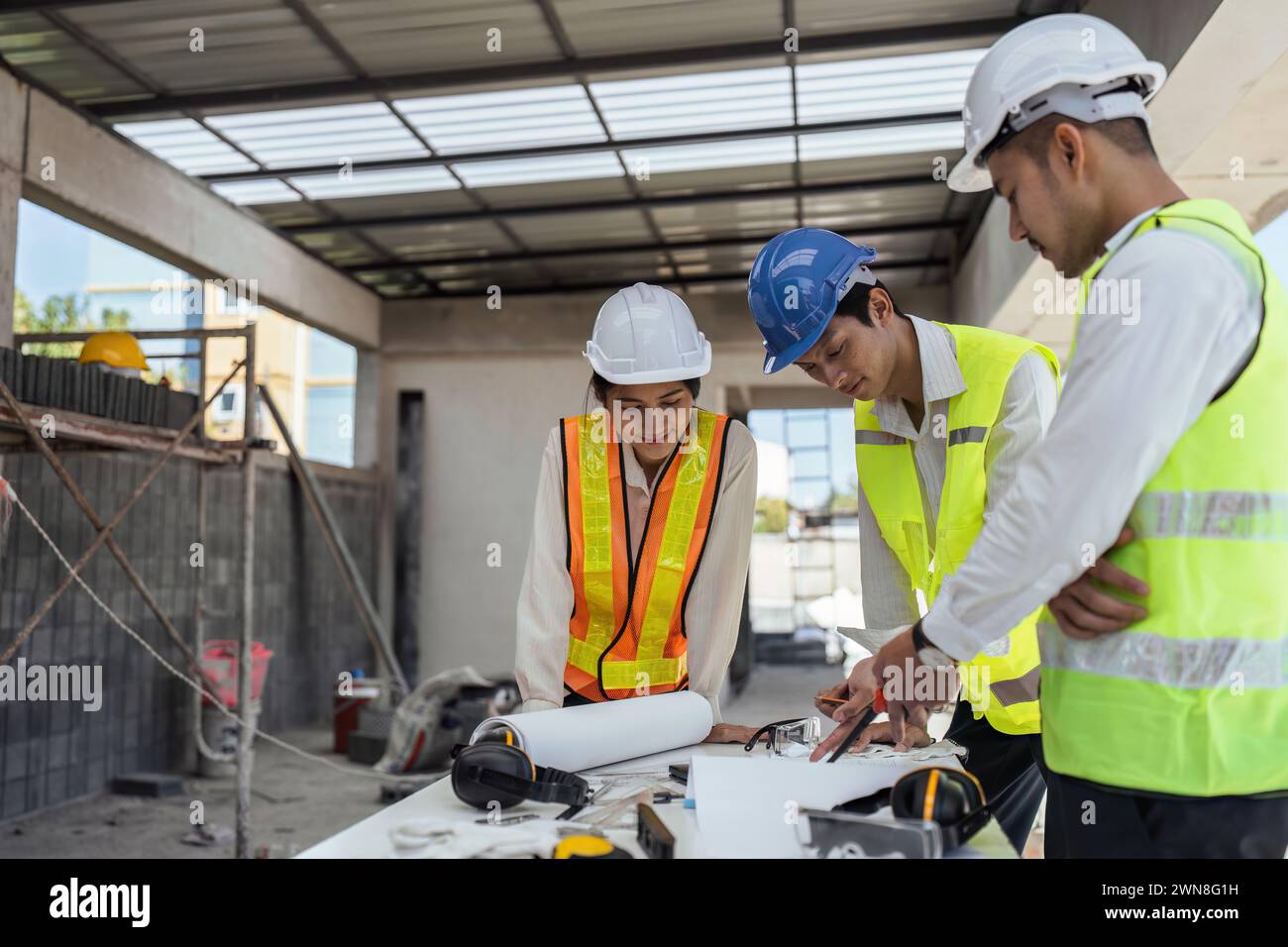 Two Specialists Inspect Commercial, Industrial Building Construction Site. Real Estate Project ...