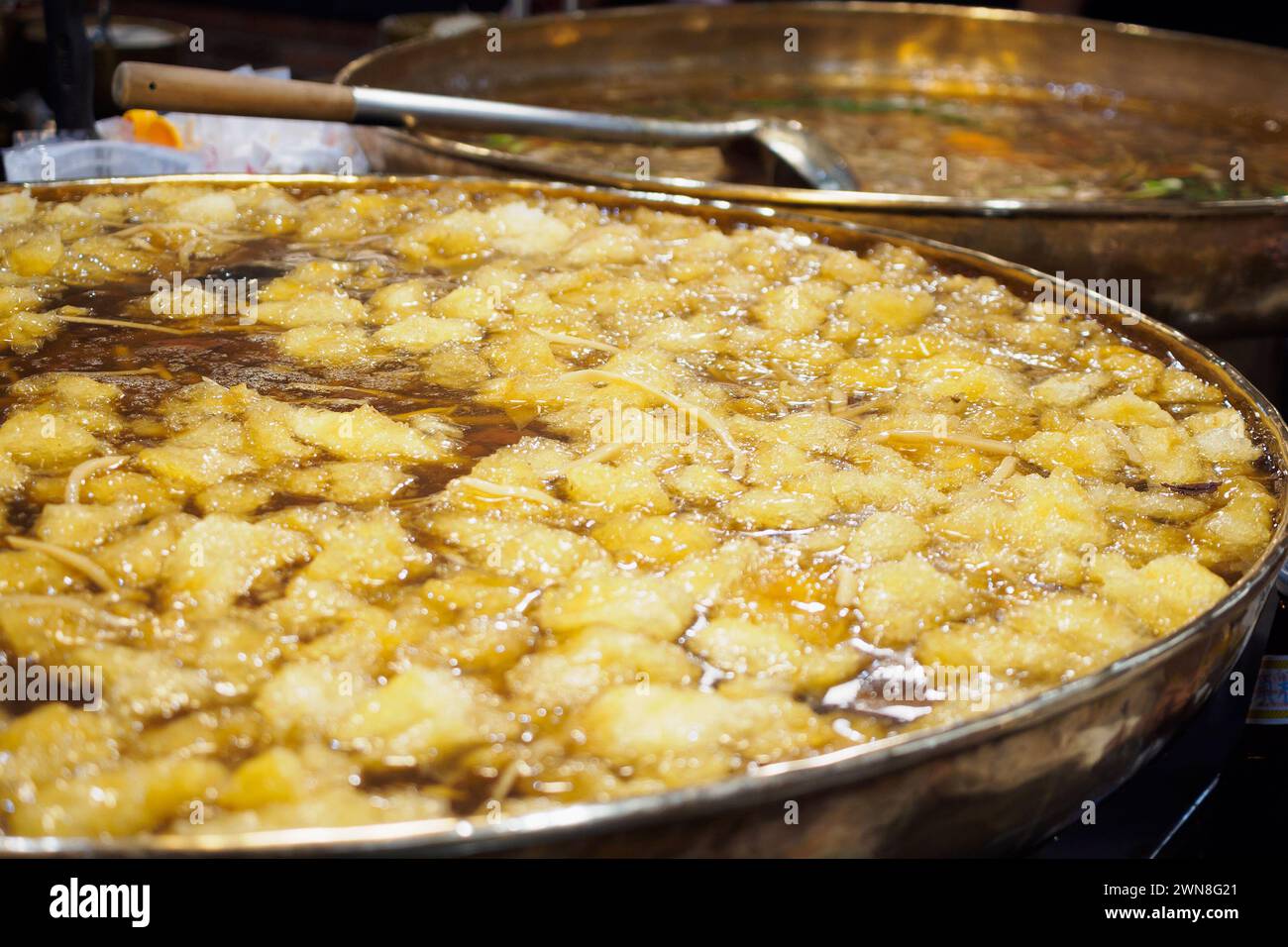 Boiled fish maw soup in big pan at Thai street food market Stock Photo ...