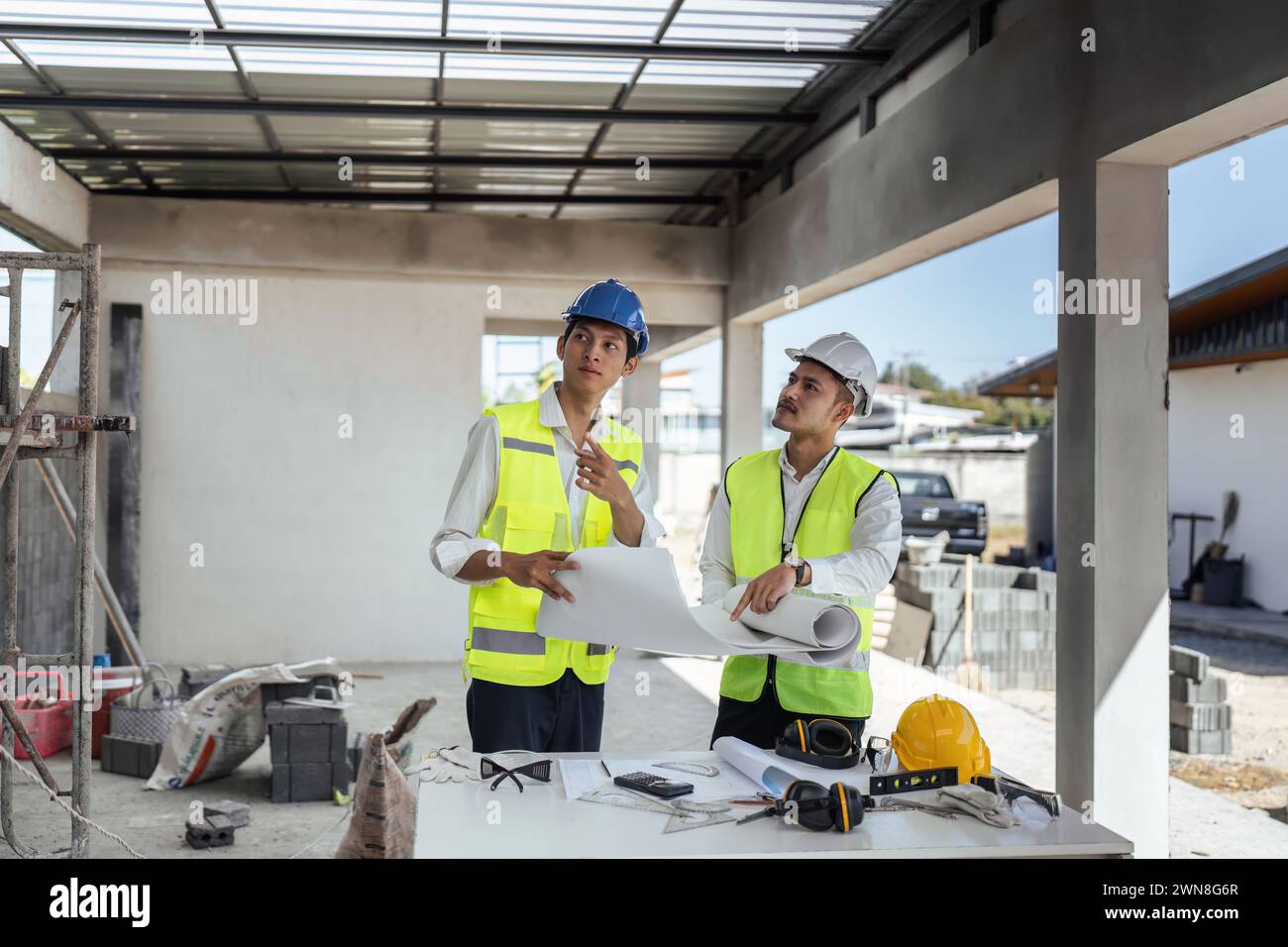 Two Specialists Inspect Commercial, Industrial Building Construction Site. Real Estate Project ...