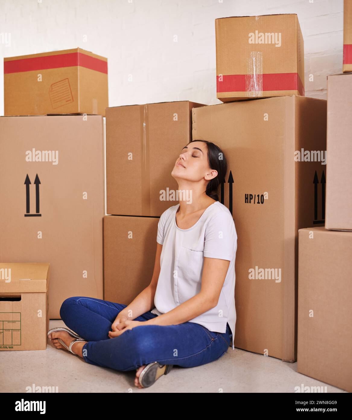 Woman, moving and boxes in living room for real estate, property ...