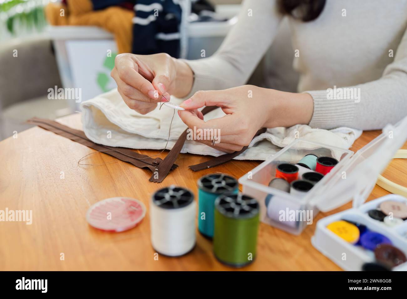 Recycle and Reuse. Designer sew from used denim fabric, old jeans ...