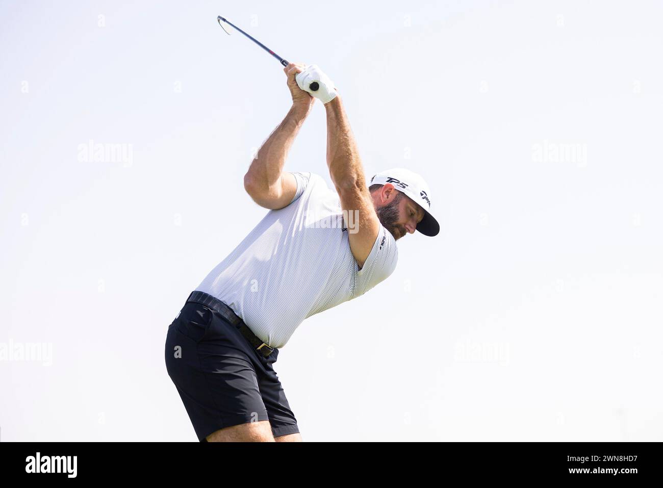 Captain Dustin Johnson of 4Aces GC hits his shot on the driving range ...
