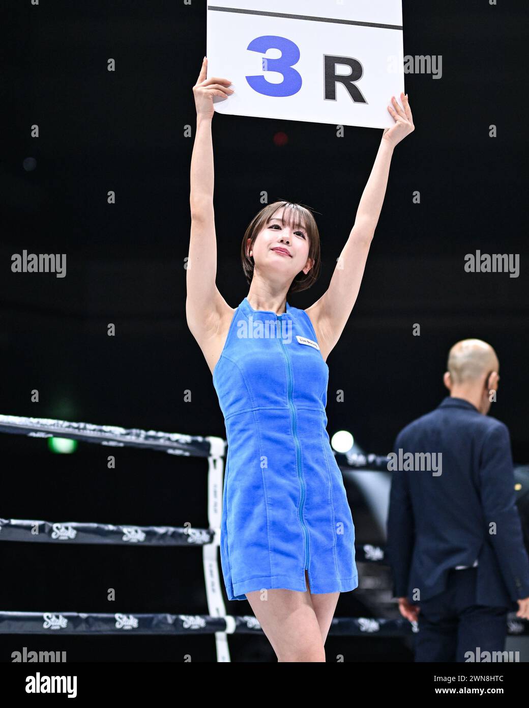 Tokyo, Japan. 24th Feb, 2024. Ring girl Yui Arata displays a third round sign during the vacant ...
