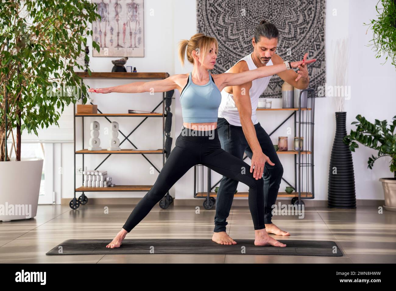 Female fitness instructor performing warrior hi-res stock photography and images - Alamy