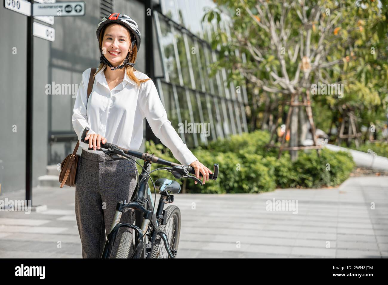 Asian businesswoman morning commute is portrait of cheerfulness. She ...