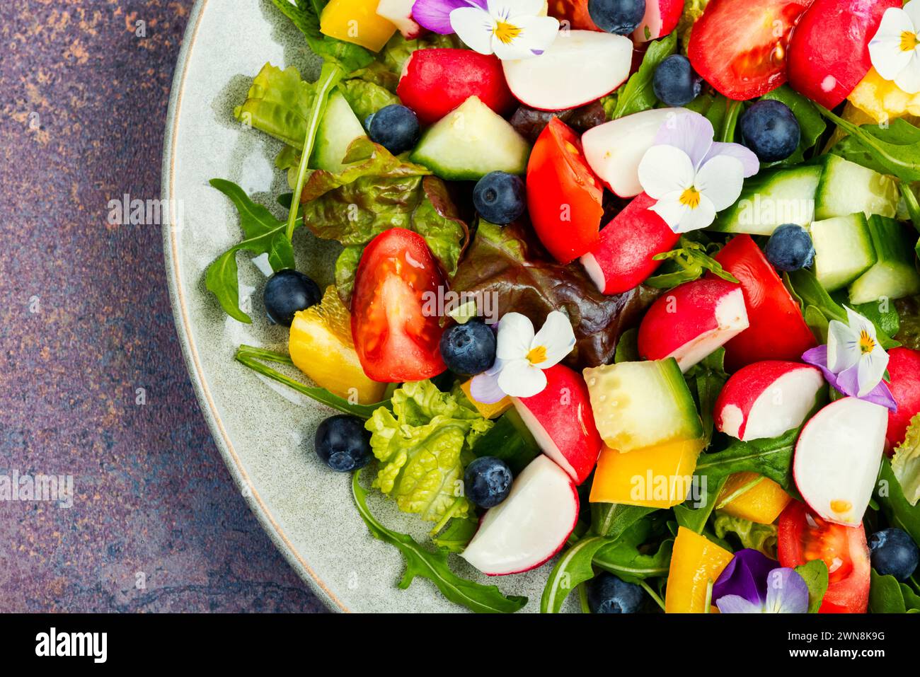 Fresh light vegetable salad with edible flowers. Low carb diet Stock ...