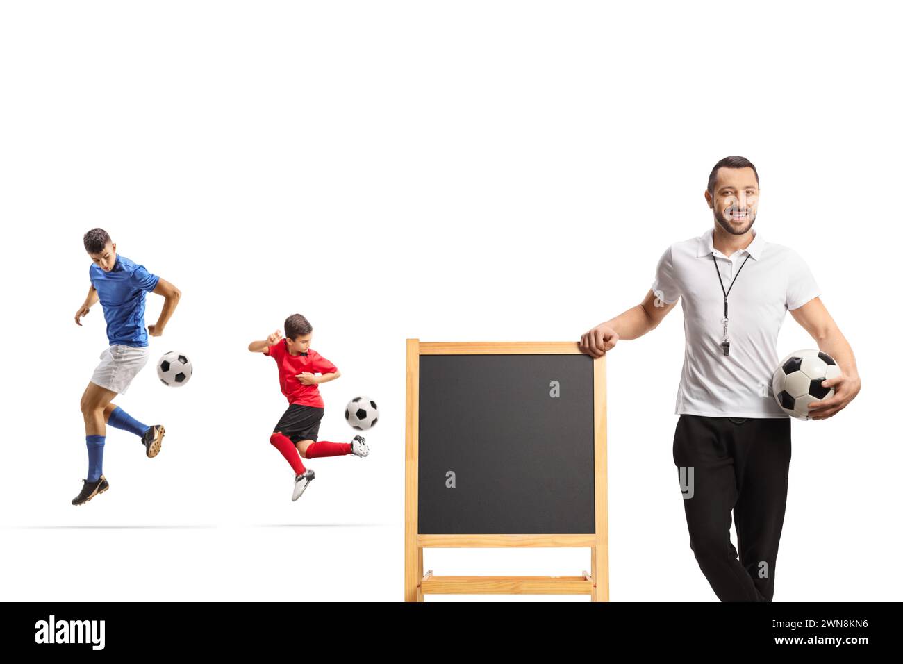 Football players at training and coach leaning on a blackboard isolated ...