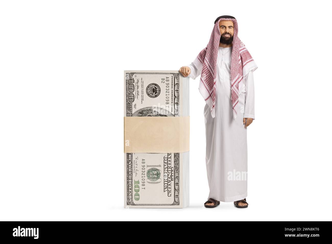 Saudi arab man with a big stack of money isolated on white background ...
