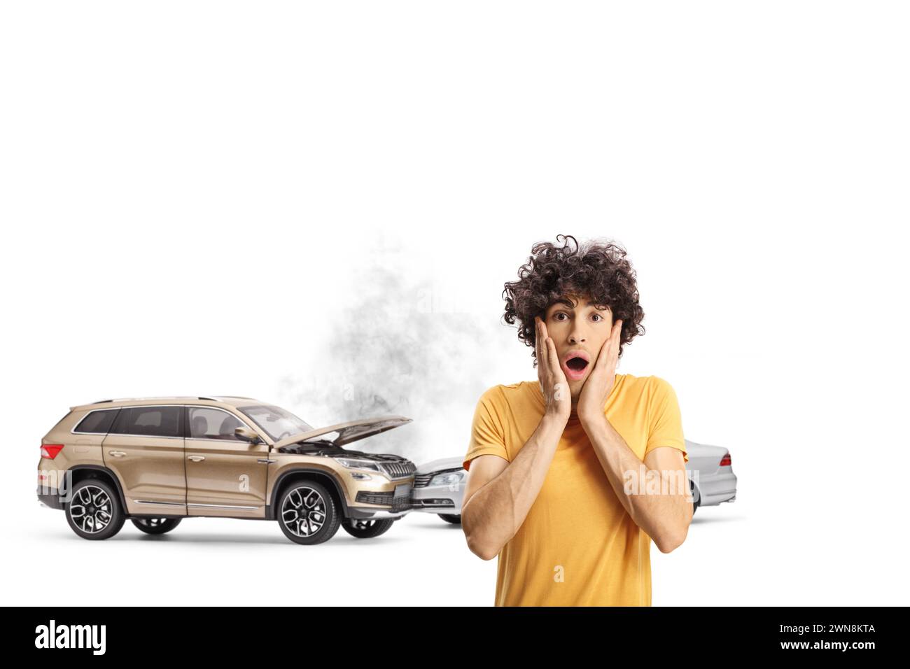 Shocked young man witnessing a car crash isolated on white background ...