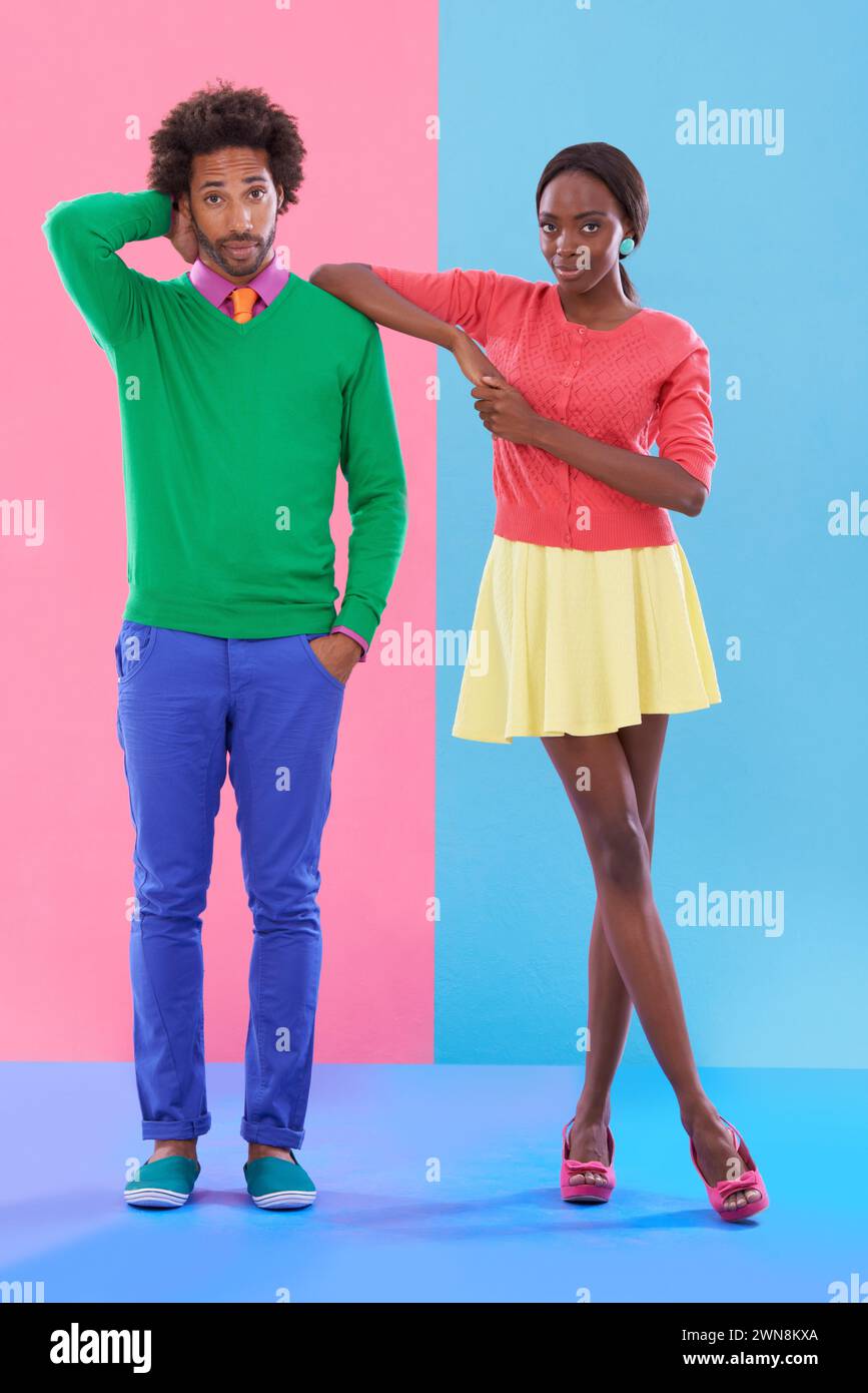 Confused, couple and portrait with fashion in studio, background and ...