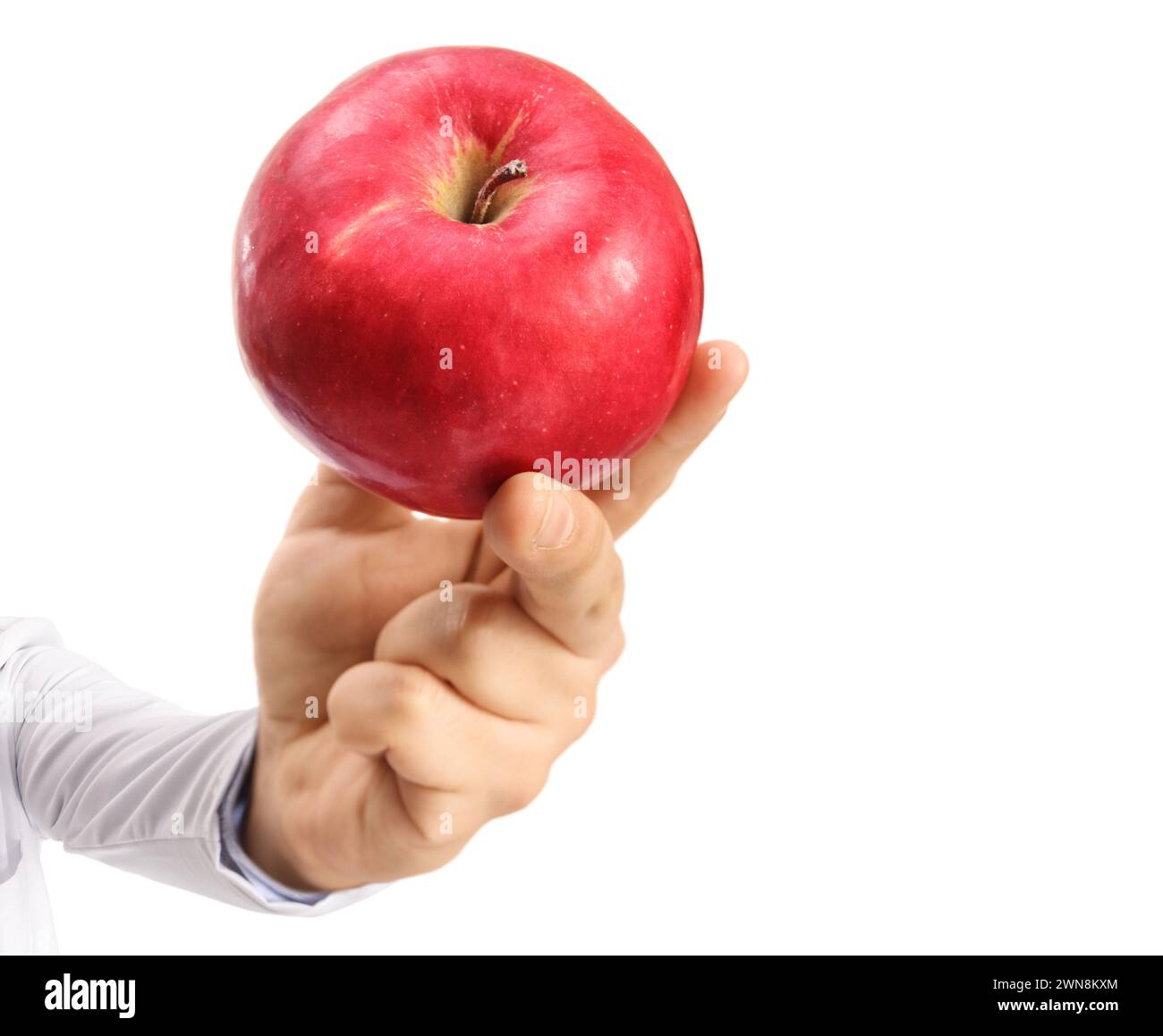 Hand holding a red apple isolated on white background Stock Photo - Alamy
