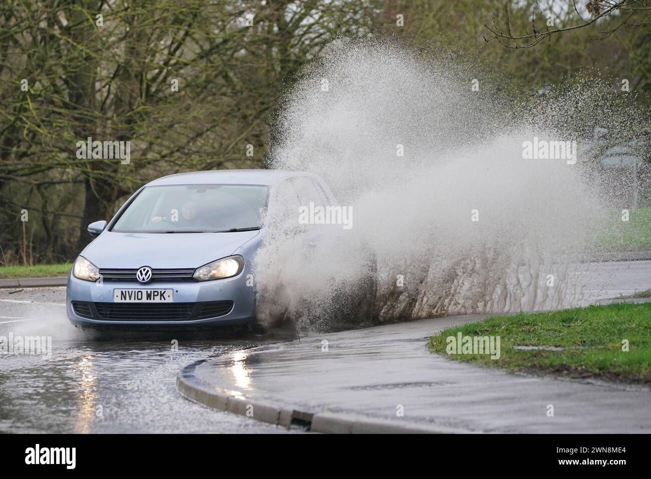 Cars driving through surface water at the Braywick roundabout in ...