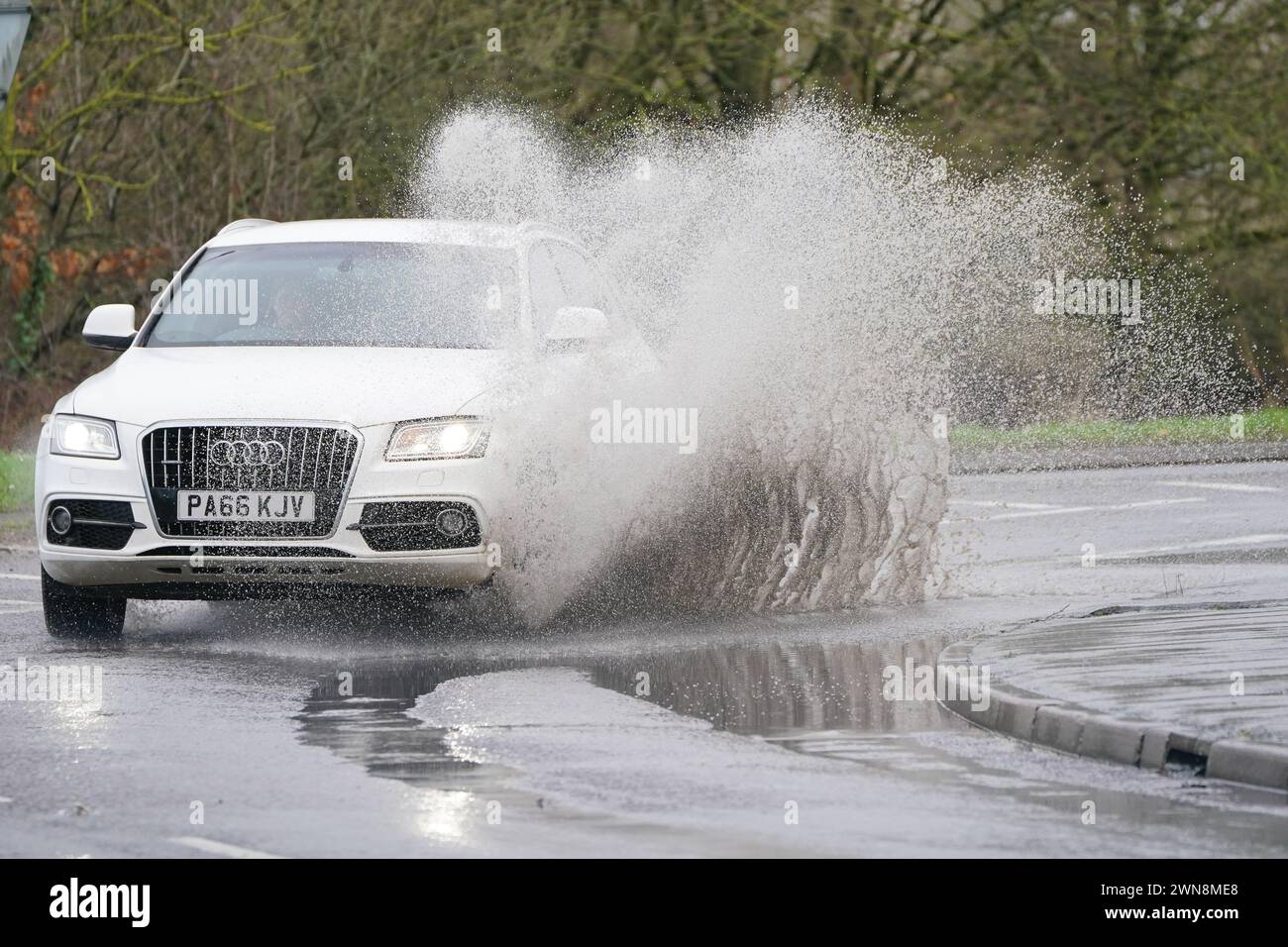 Cars driving through surface water at the Braywick roundabout in ...
