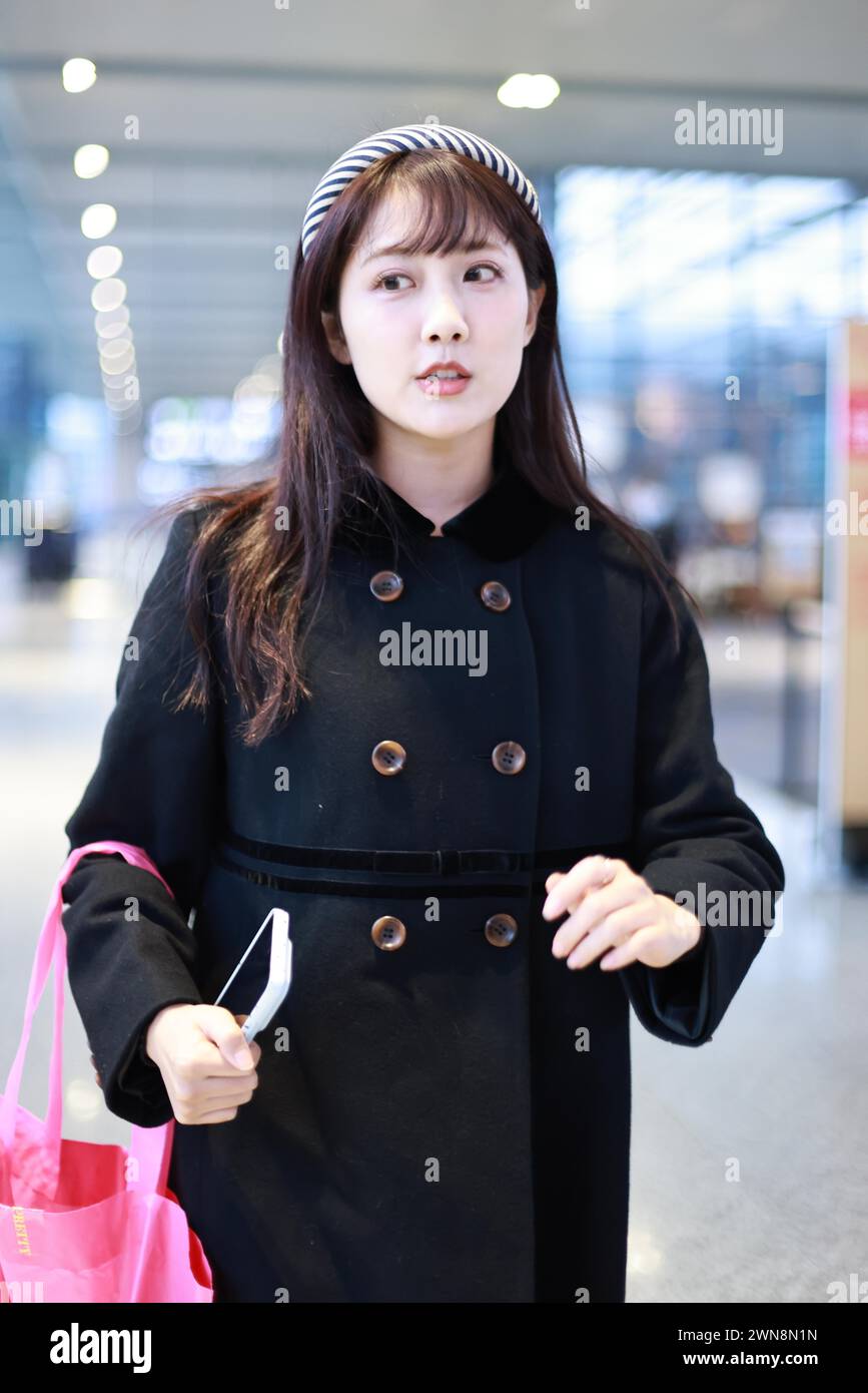Chinese idol singer and actress Li Yitong appears at the airport in ...