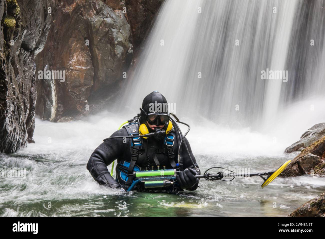 Front view of scuba diving holding metal detection instrument Stock ...