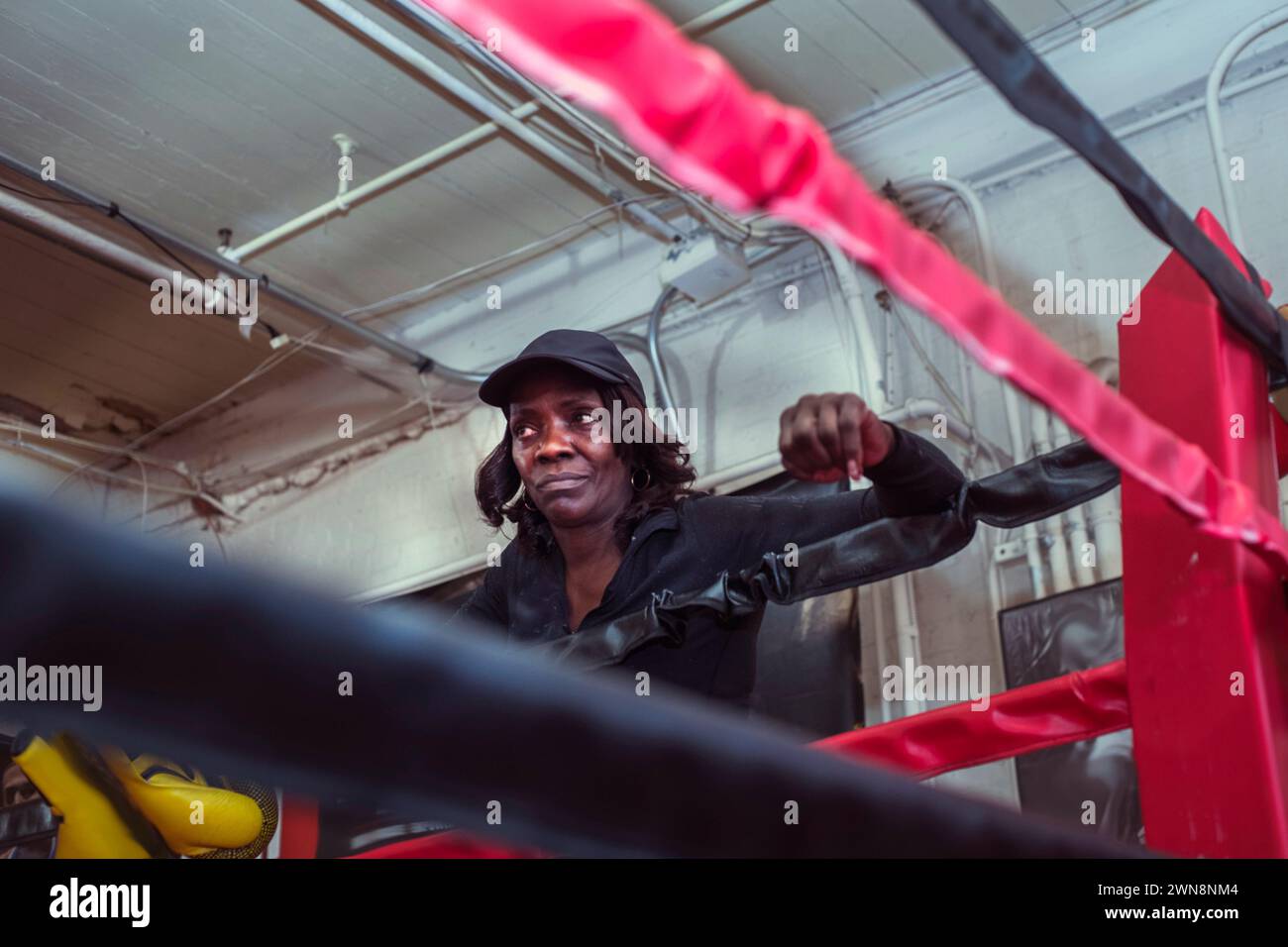Coach watching girls in ring Stock Photo - Alamy