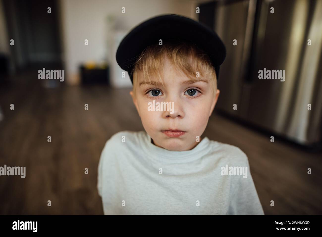 Child boy looking at camera staring hi-res stock photography and images ...