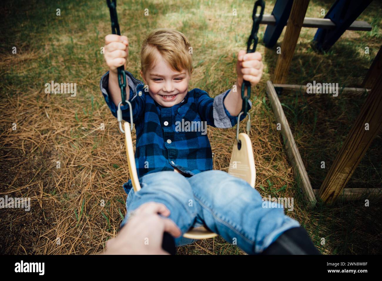 Child pushed on swing hi-res stock photography and images - Alamy