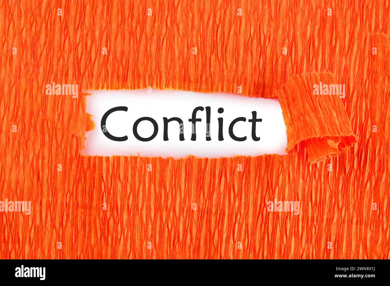 Conflict word on a white sheet under an orange background Stock Photo ...