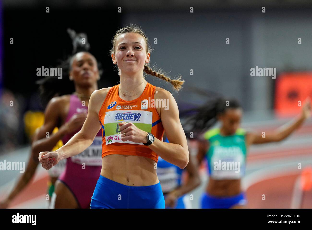 Femke Bol, of the Netherlands, reacts after finishing her women's 400 ...