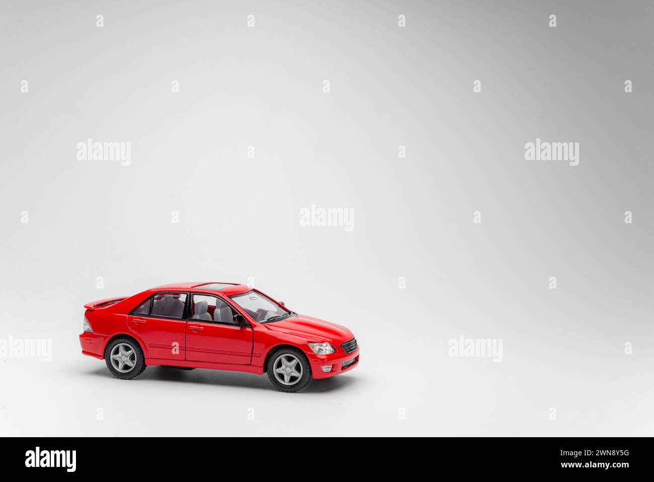 Red Toy car isolated on white background Stock Photo - Alamy