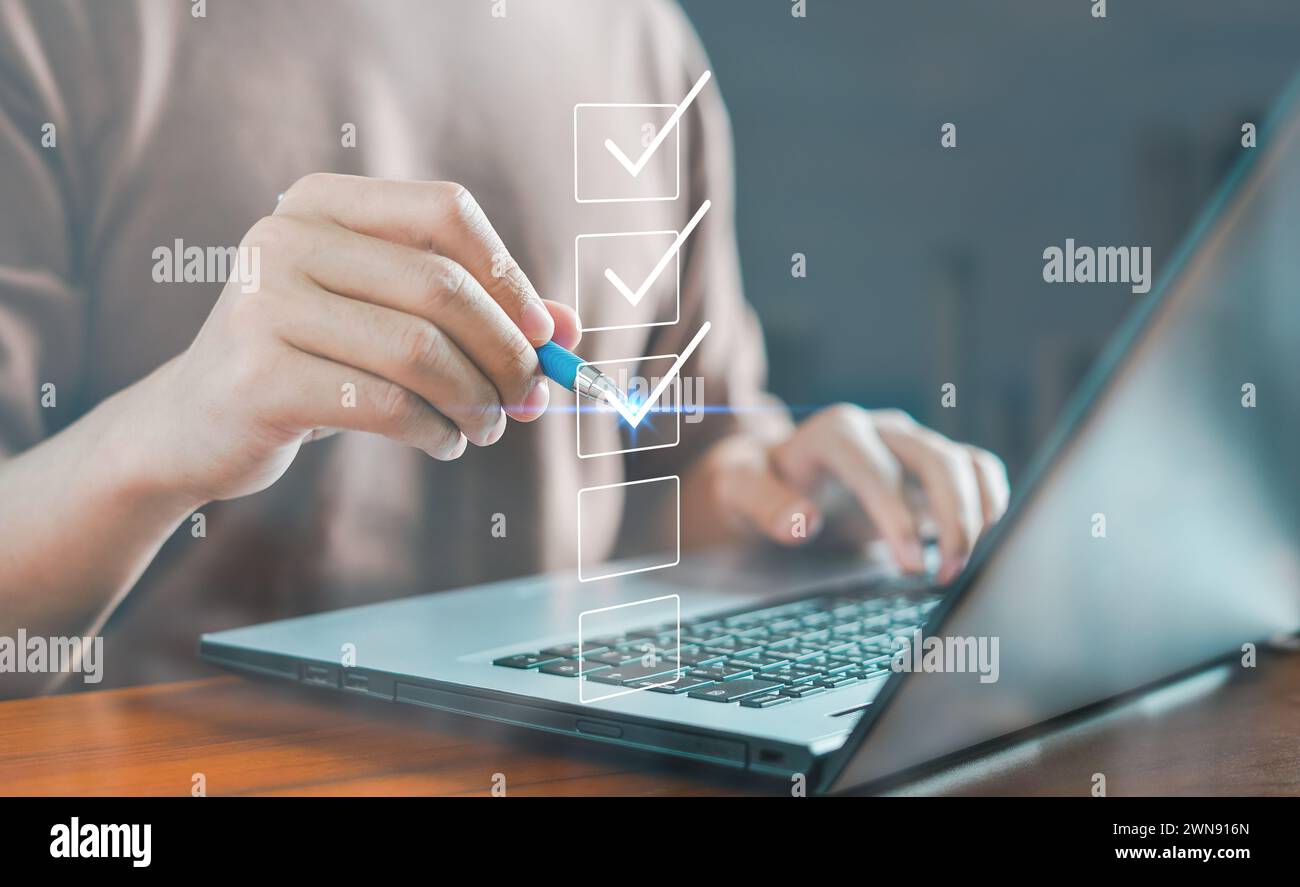 Evaluate performance checklist, questionnaire, Businessman using laptop ... Evaluate performance checklist, questionnaire, Businessman using laptop ...