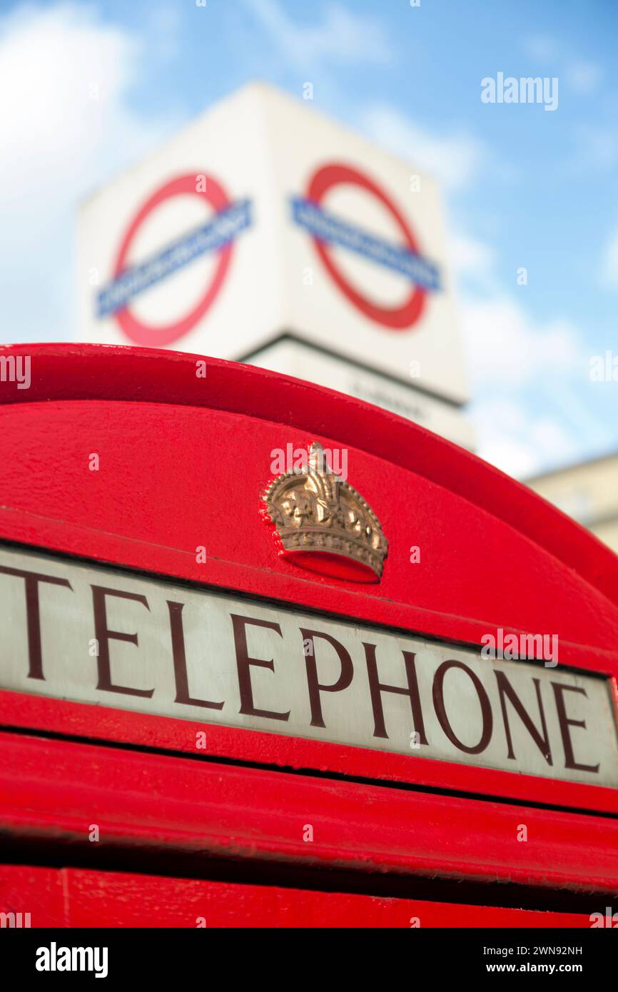 Red Telephone and London underground sign Stock Photo - Alamy