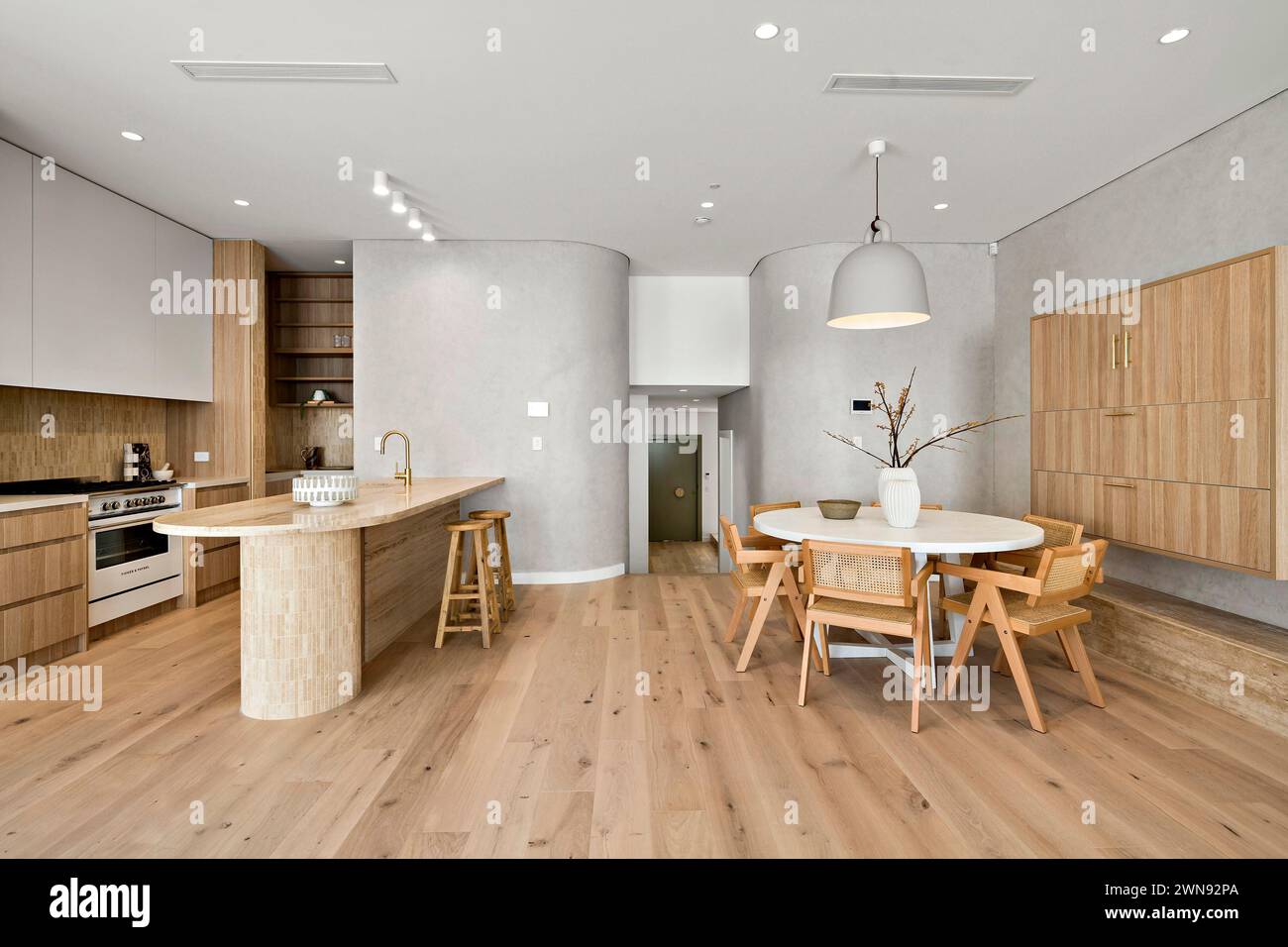 A clean, empty kitchen with wood floors and cabinets Stock Photo - Alamy