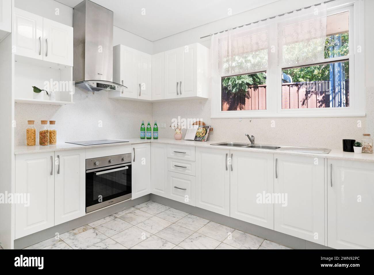 A neat and organized kitchen with ample storage space in drawers and ...