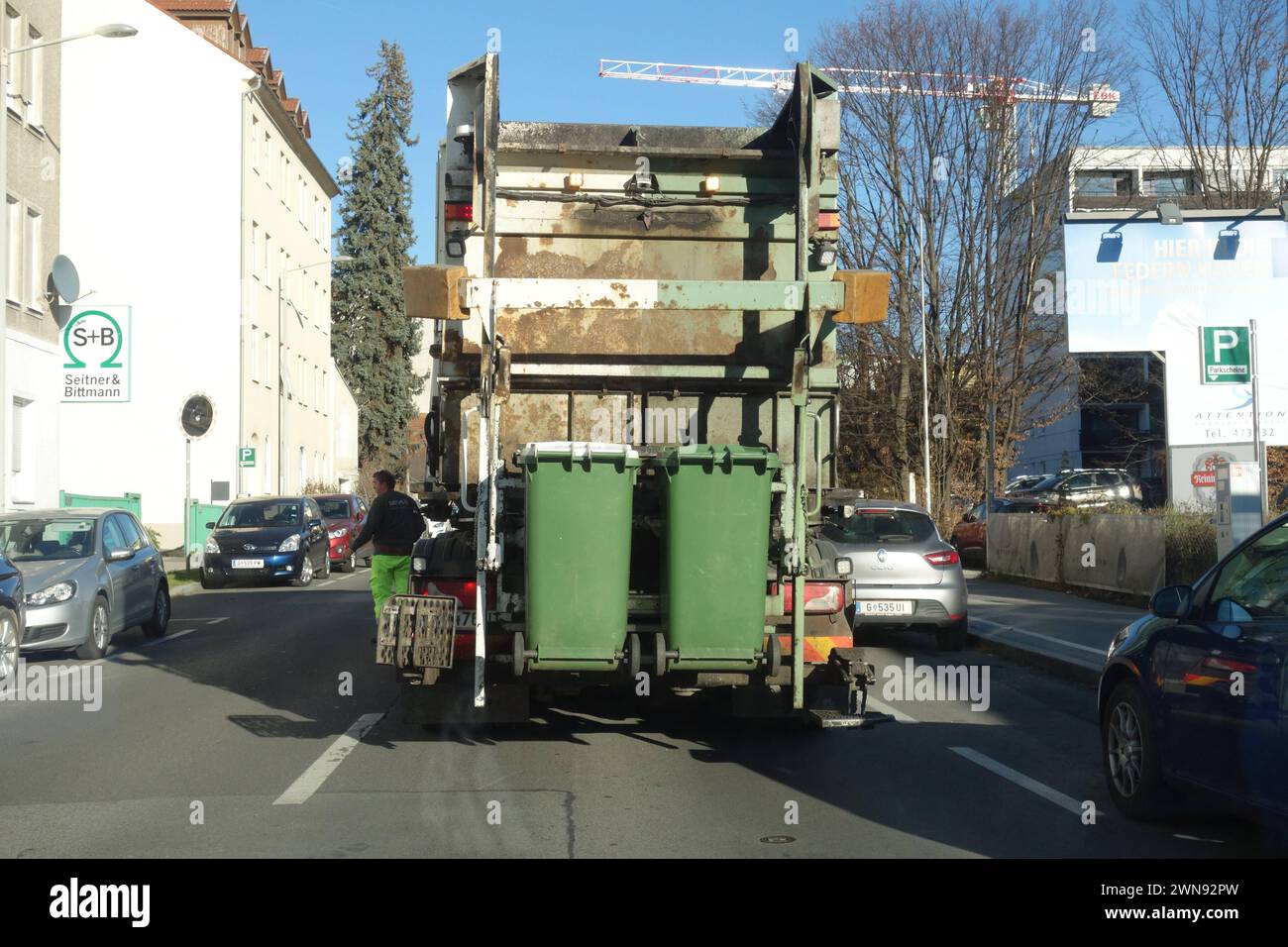a garbage man at the waste collection, waste separation and recycling ...