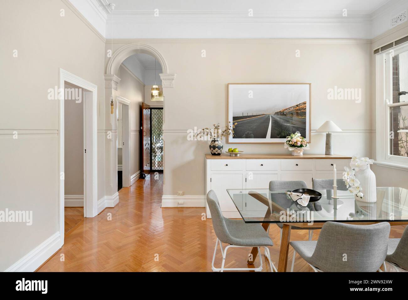 A bright dining room with white furniture, creating a clean and airy ...