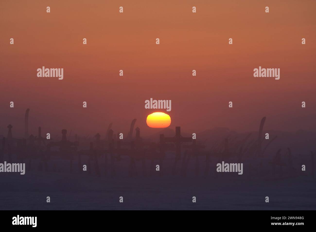 Sunset over graveyard site marked by whale rib bones outside the oldest ...