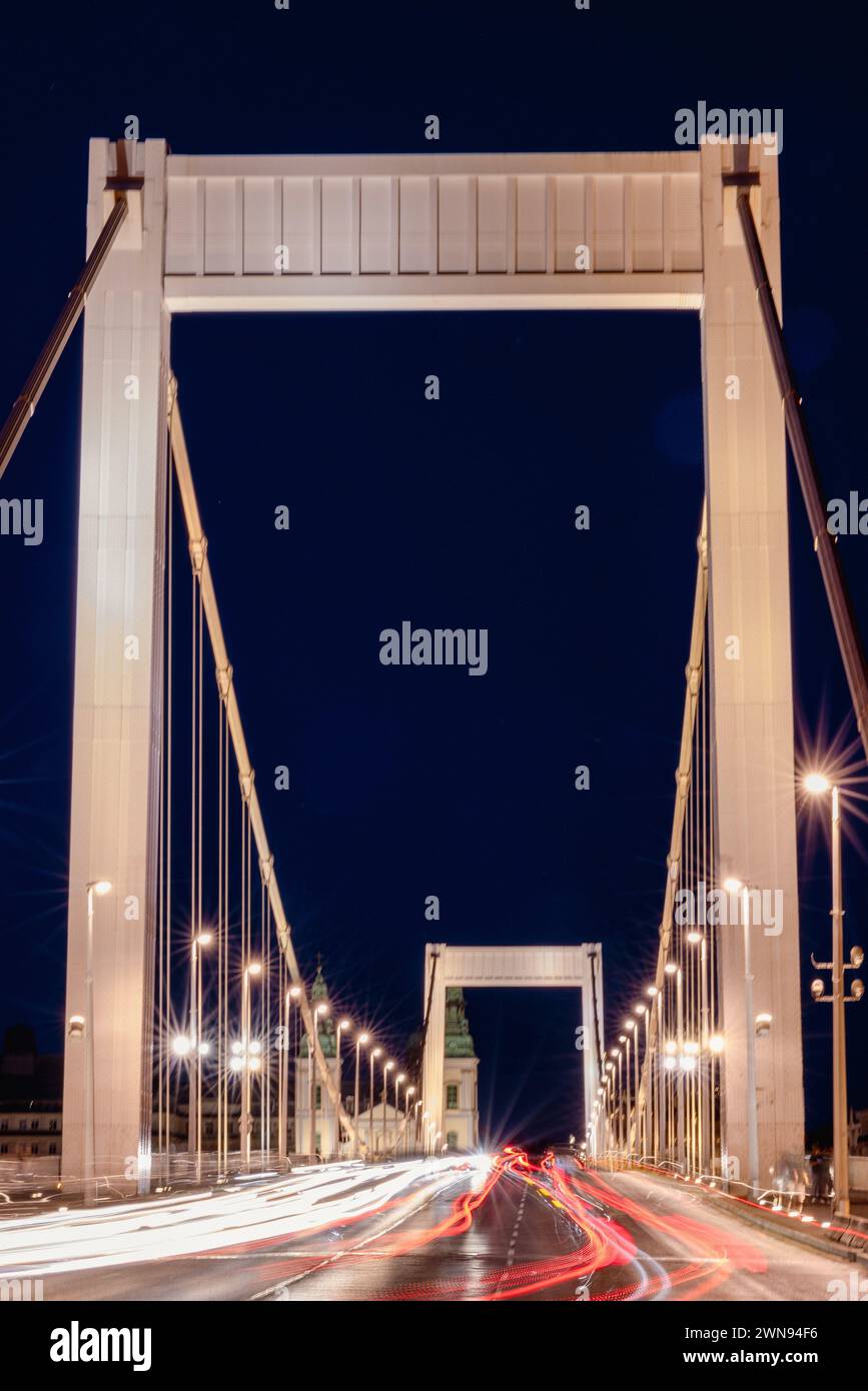 A long exposure of cars on bridge at night Stock Photo - Alamy