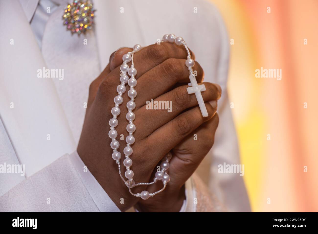 Man holding rosary beads hi-res stock photography and images - Alamy
