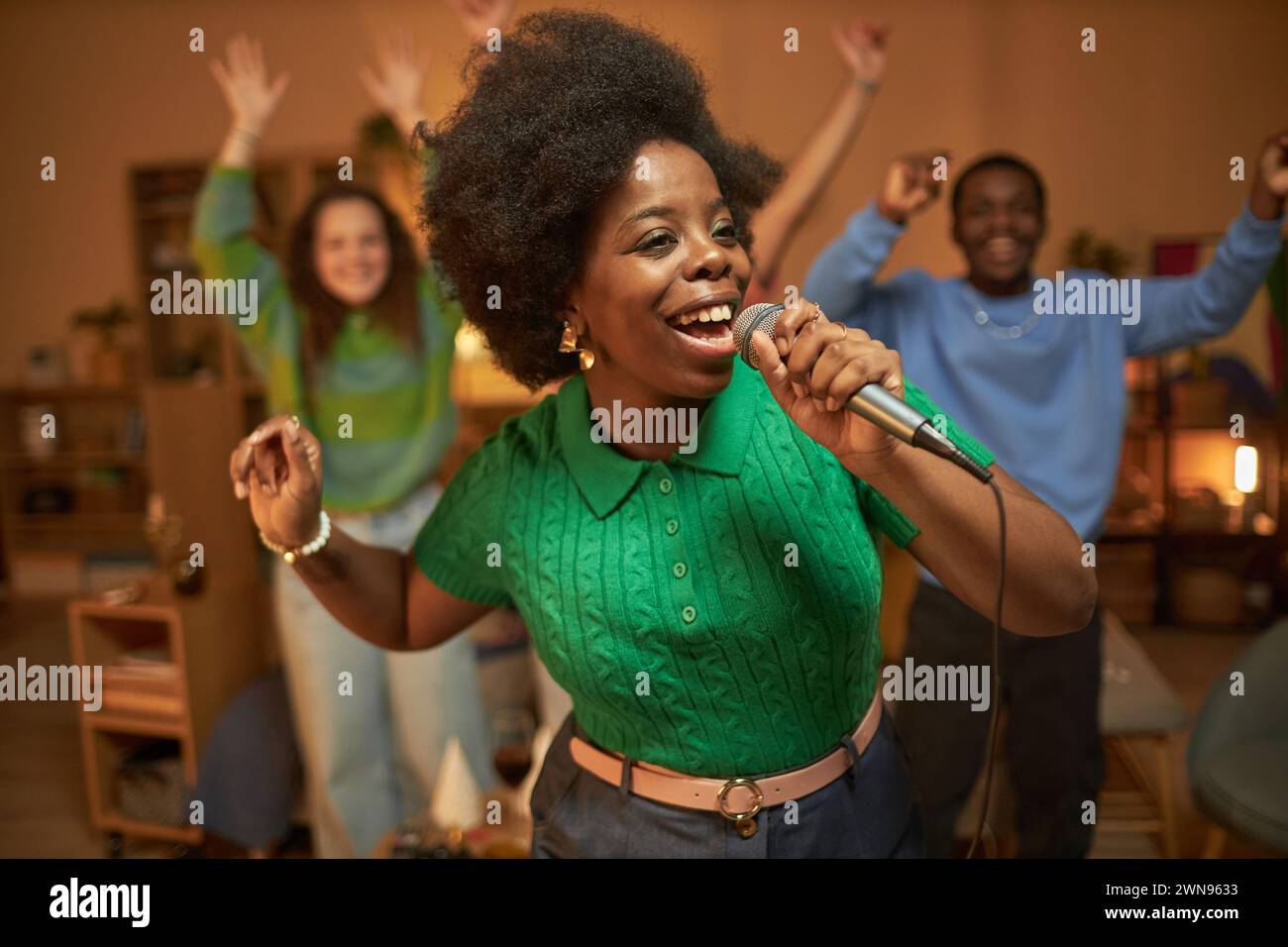 African woman singing karaoke hi-res stock photography and images - Alamy