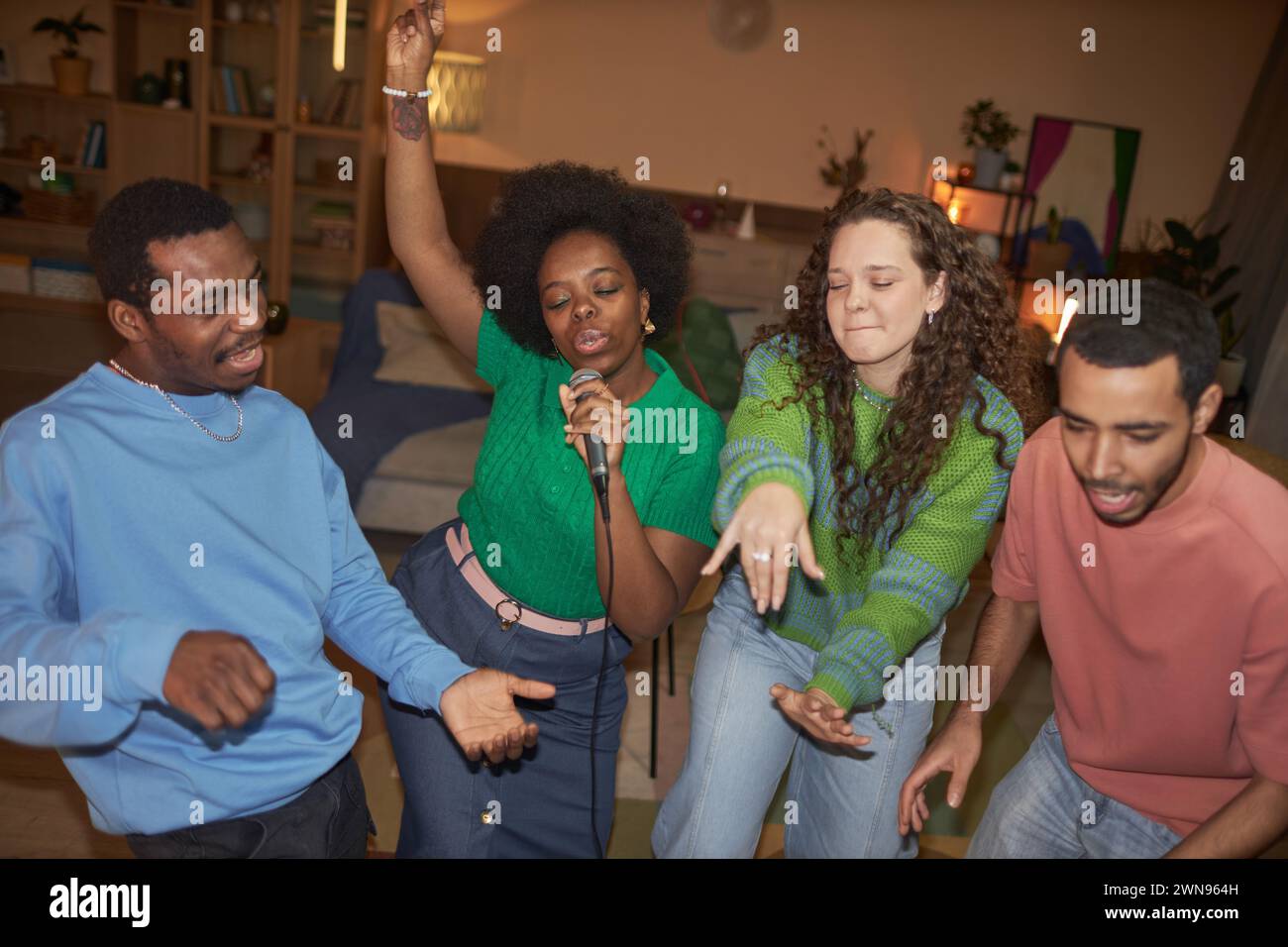 Diverse group singing karaoke hi-res stock photography and images - Alamy