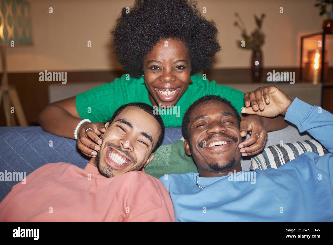 Front view portrait of diverse group of three friends with Black young ...