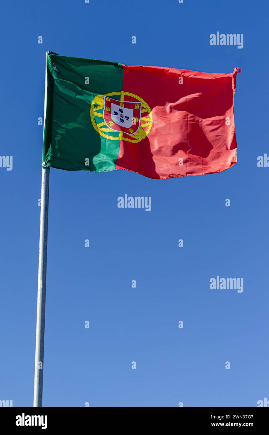 flag of Portugal on a blue sky background Stock Photo - Alamy