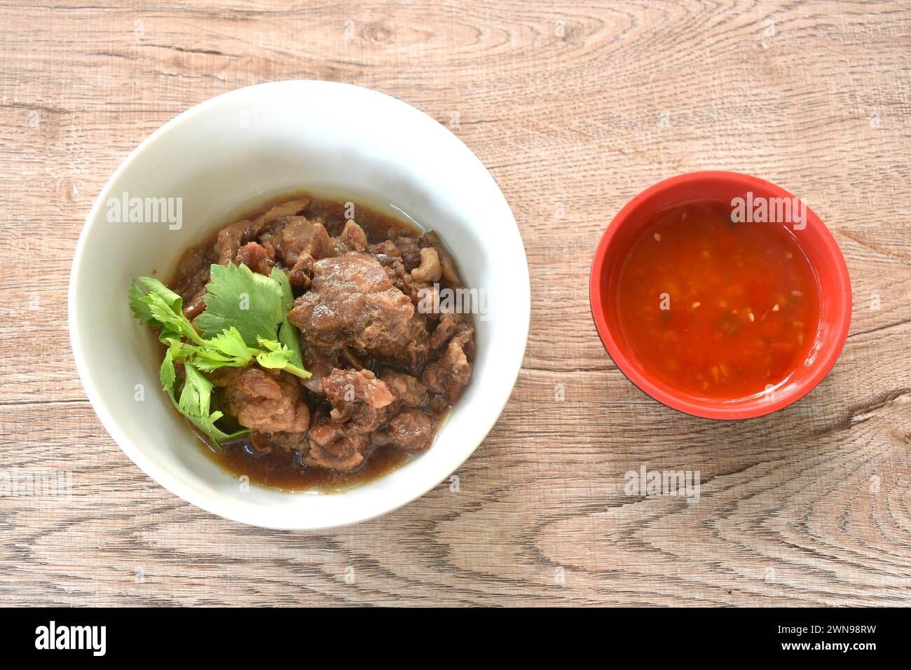 braised beef meat stew topping slice celery on bowl dipping chili sauce ...