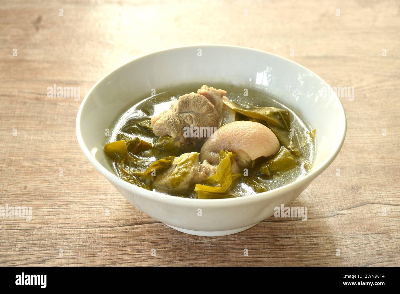 boiled pork leg and belly with cowa leaf soup on bowl Stock Photo - Alamy